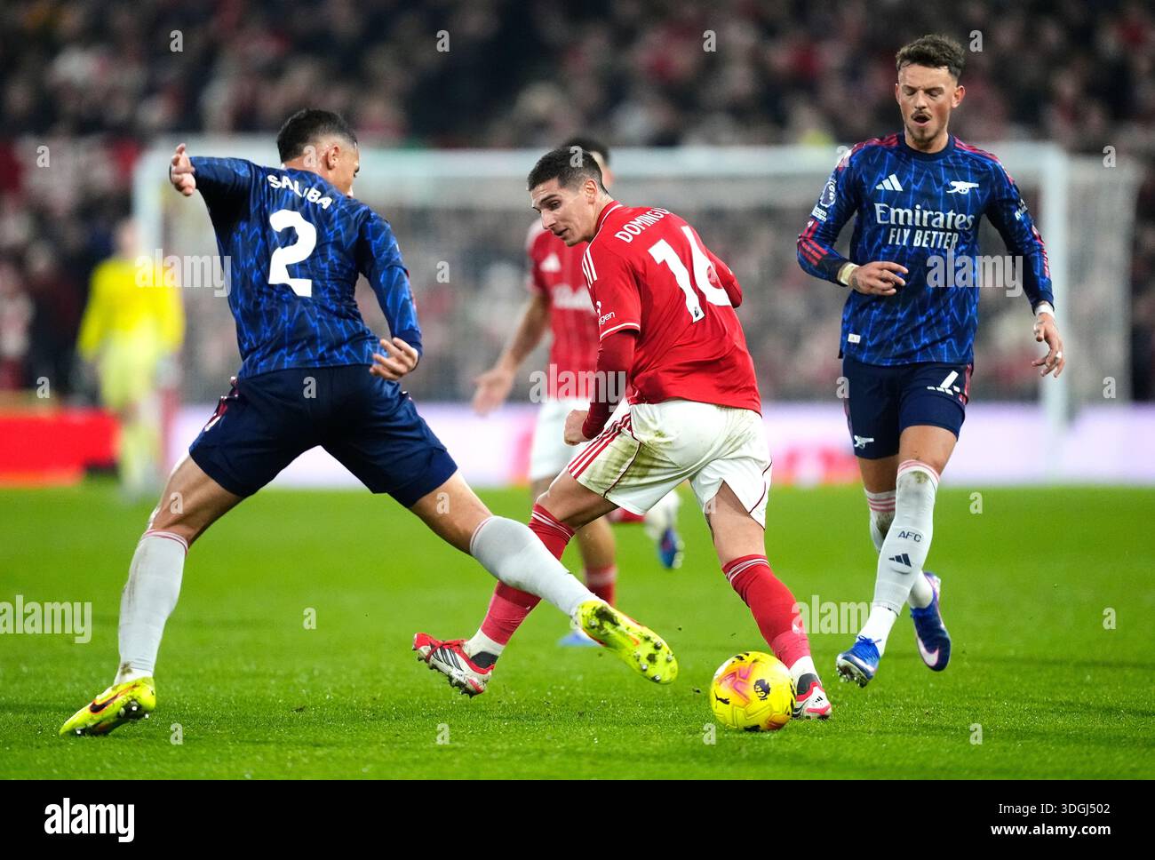 Nottingham Forest's Nicolas Dominguez (centre) attempts a back-heal ...