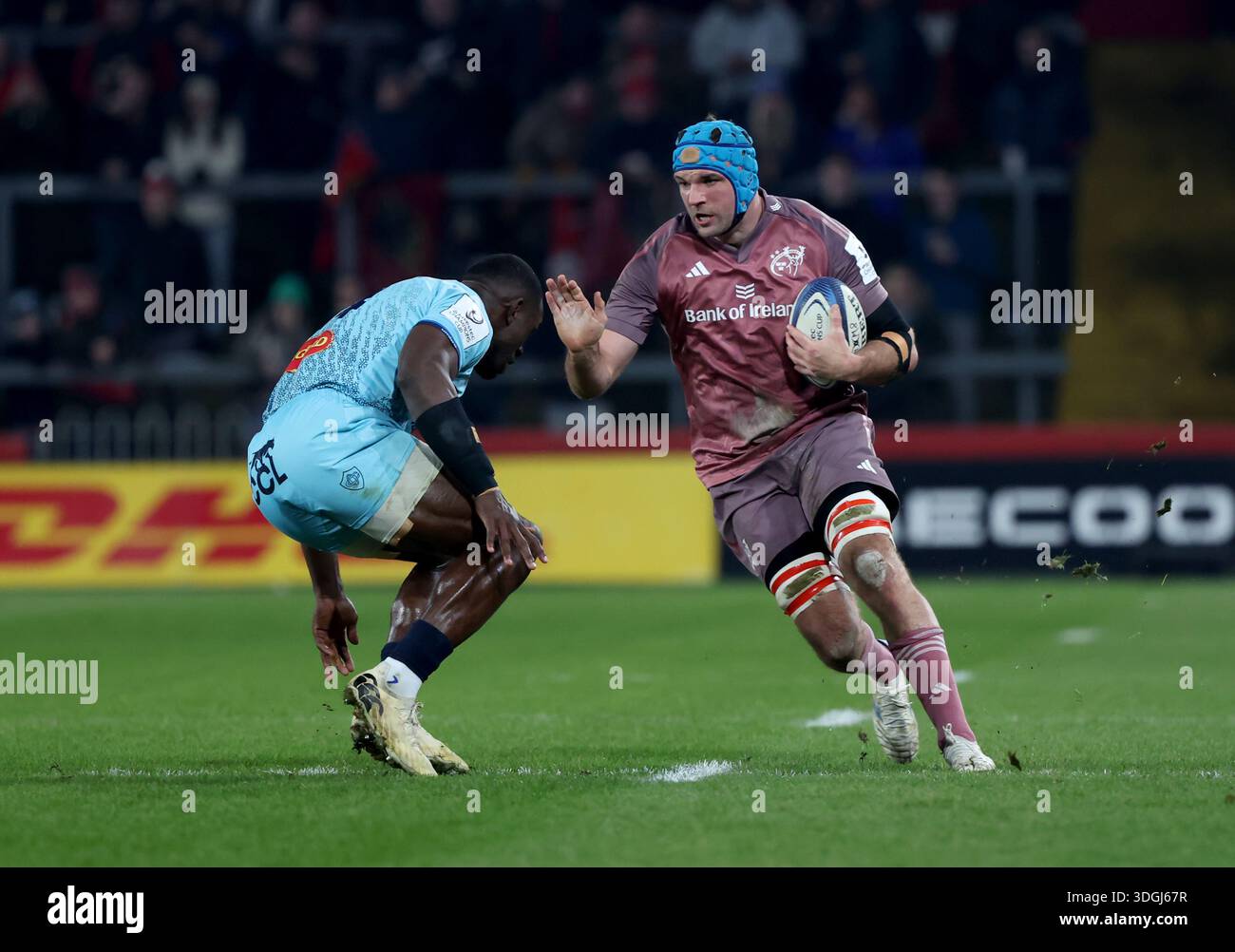 Munster Rugby's Tadhg Beirne (right) hands off Castres' Christian ...
