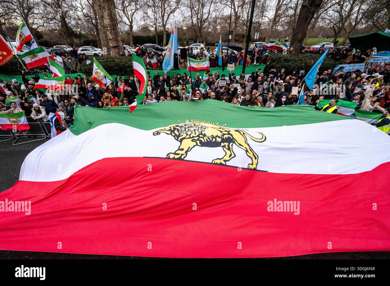 London, UK. 17 January 2026. Protesters hold a giant national flag ...