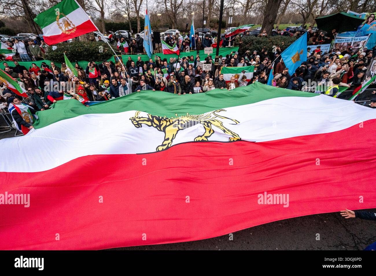 London, UK. 17 January 2026. Protesters hold a giant national flag ...