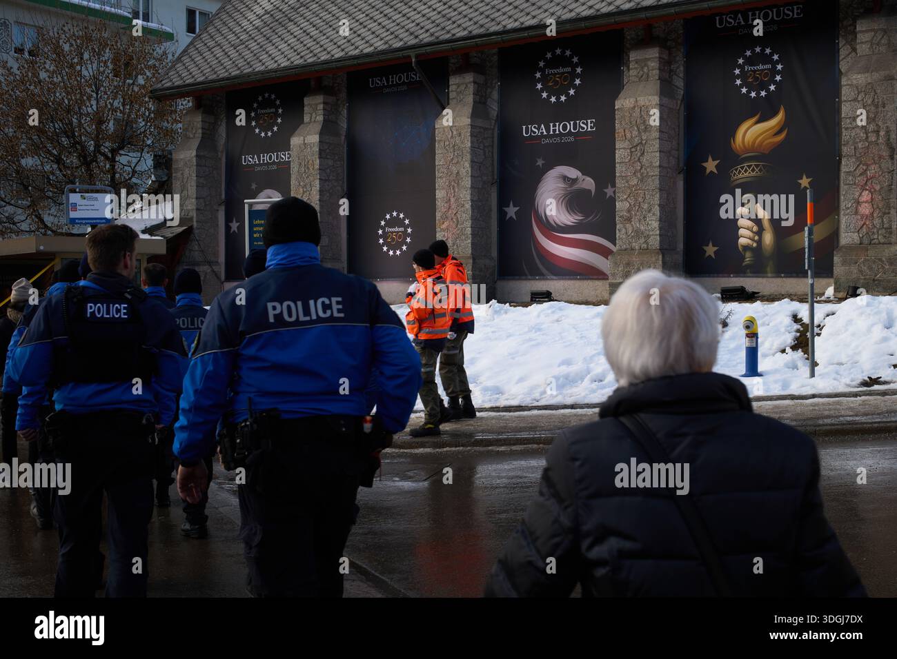 Police officers walk in front of the USA house ahead of the Annual ...