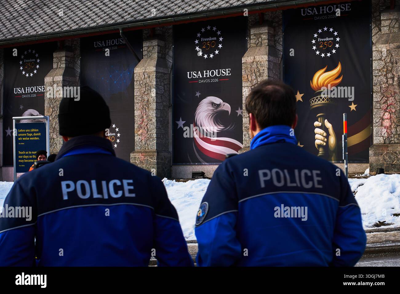 Police officers walk in front of the USA house ahead of the Annual ...