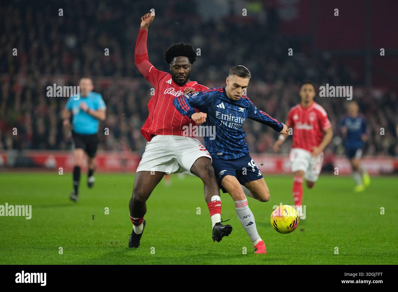 Ola Aina of Nottingham Forest and Leandro Trossard of Arsenal seen in ...