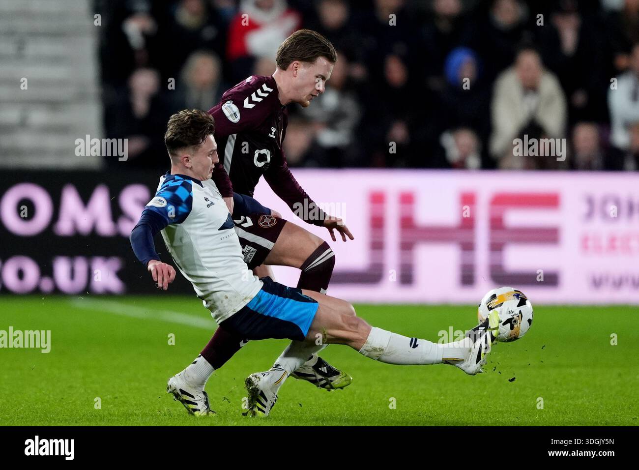 Falkirk's Finn Yeats (front) and Heart of Midlothian's Jordi Altena ...