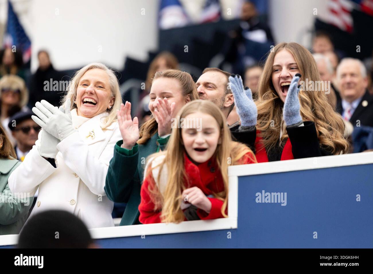 Governor Abigail Spanberger stands with her family as a parade goes by ...