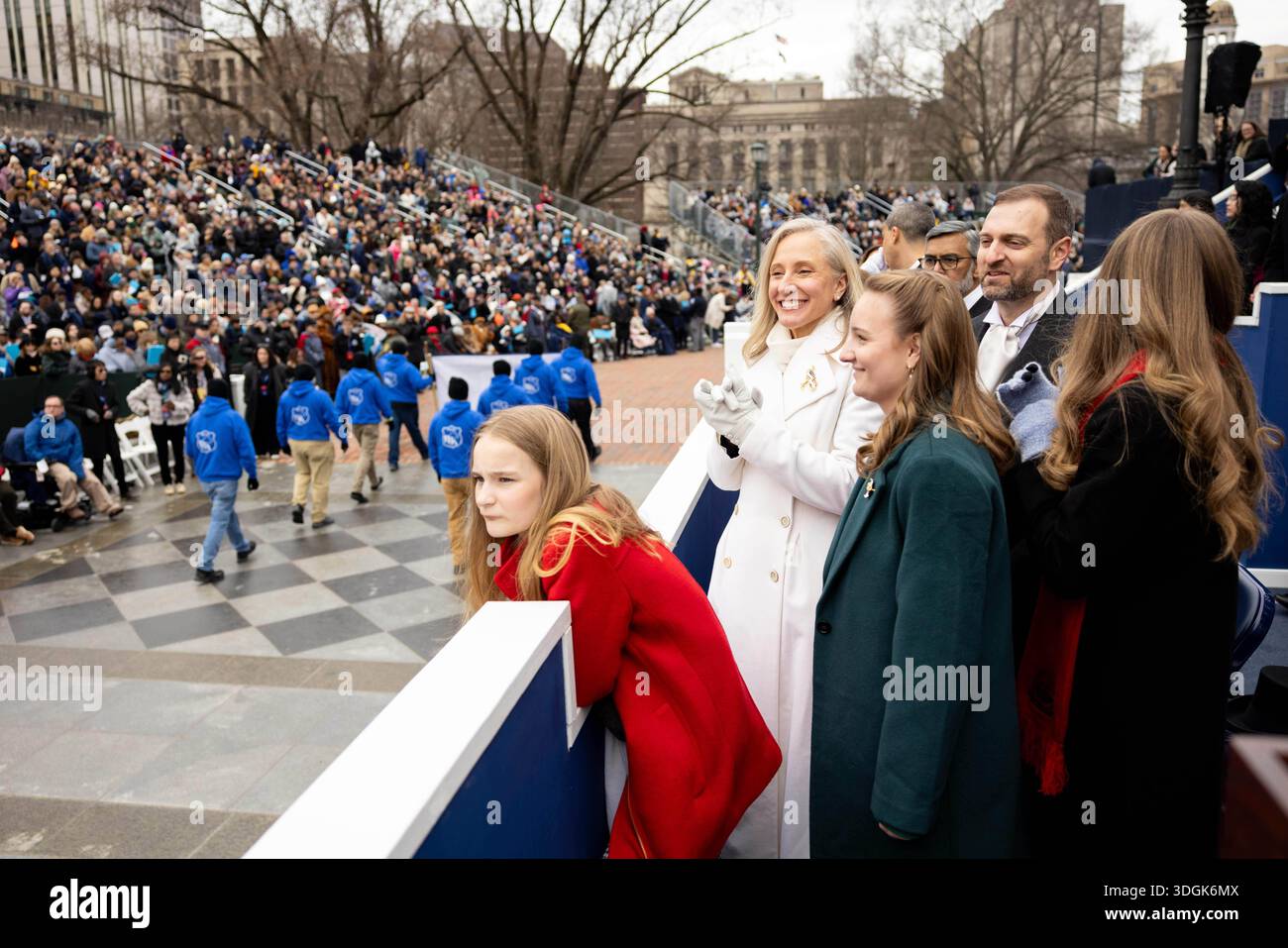 Governor Abigail Spanberger stands with her family as a parade goes by ...