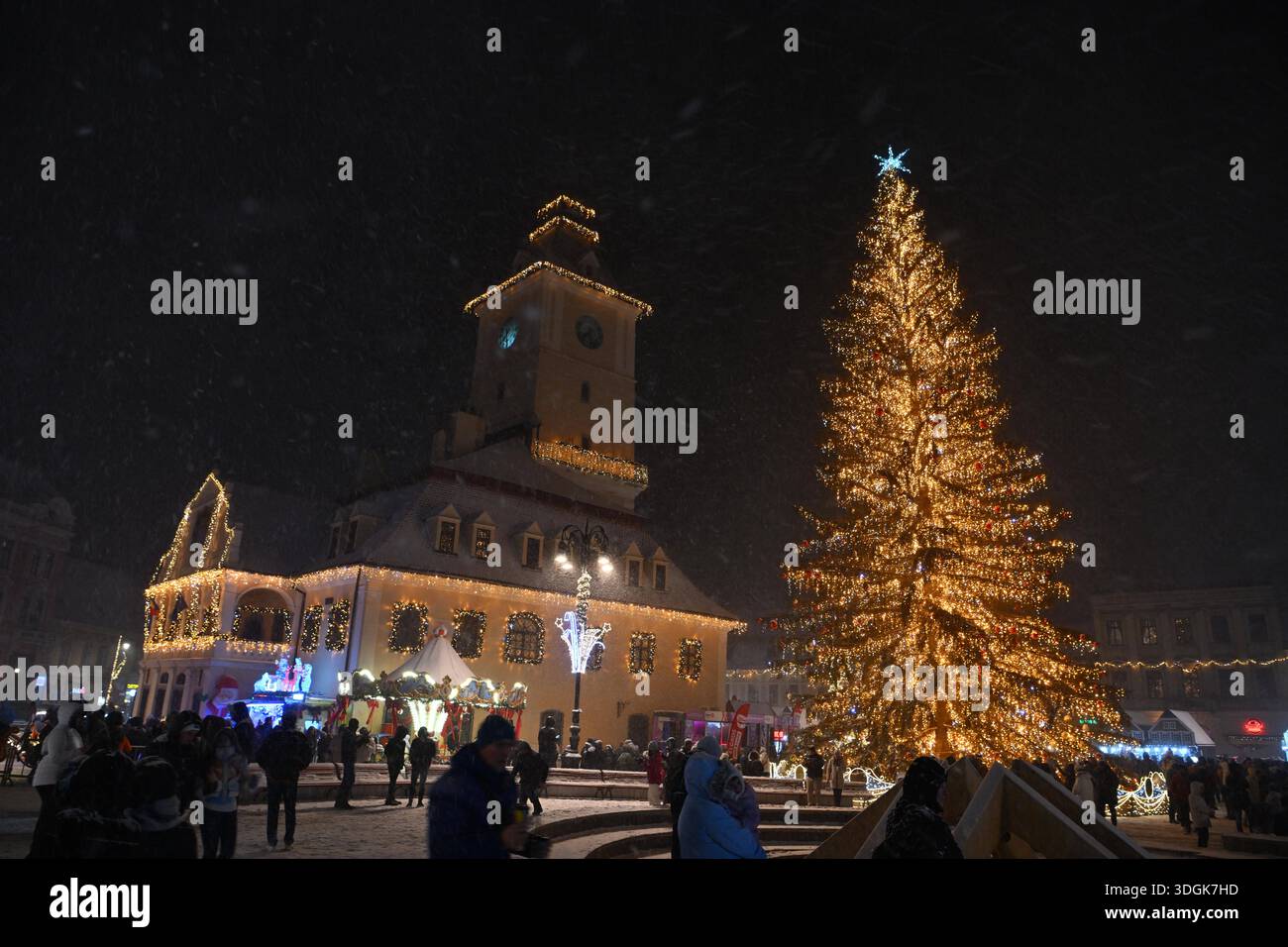BRASOV, winter People enjoy the snow in Piata Sfatului in Brasov ...