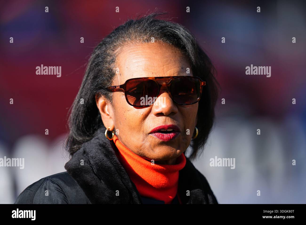 Condoleezza Rice walks on the field before an NFL divisional round ...