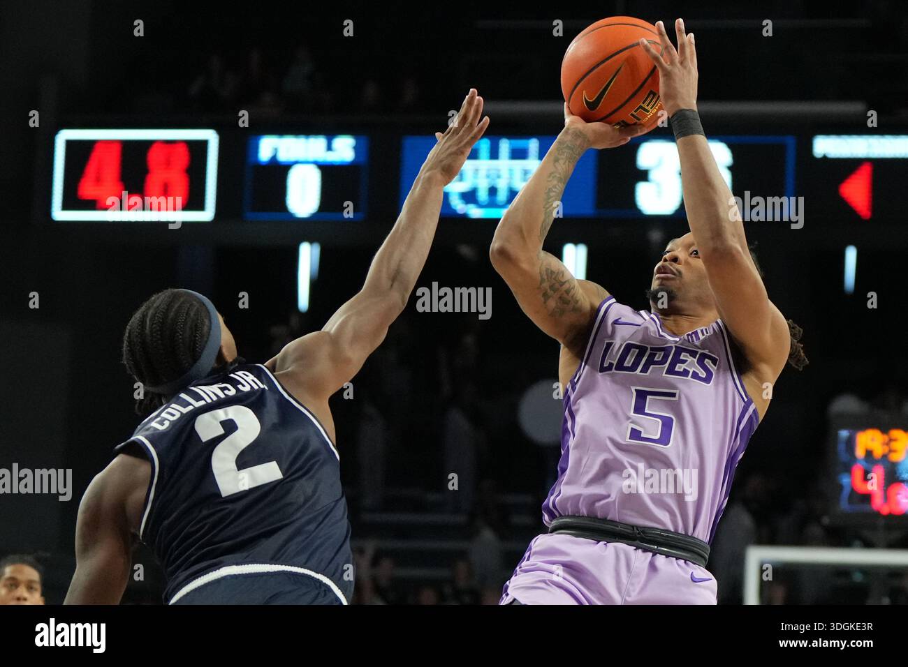 Grand Canyon guard Brian Moore Jr. shoots over Utah State guard Mj ...