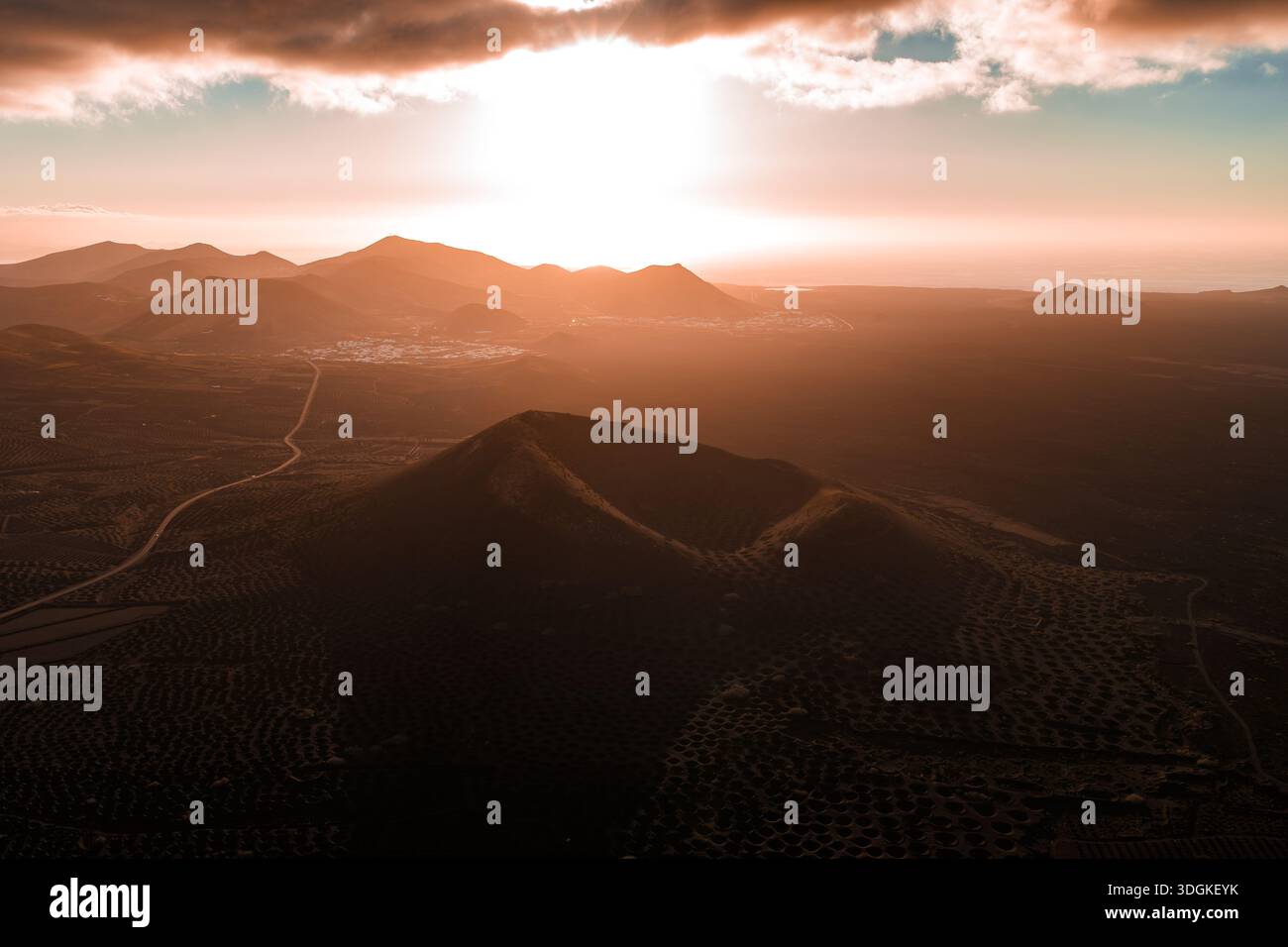 Aerial golden hour view of Lanzarote cinder cone and La Geria pits ...