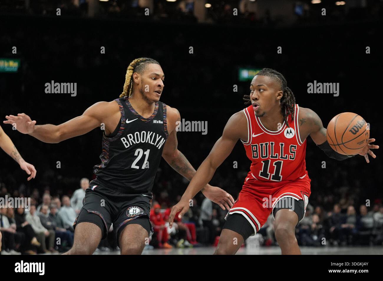 Chicago Bulls' Ayo Dosunmu (11) drives past Brooklyn Nets' Noah Clowney ...