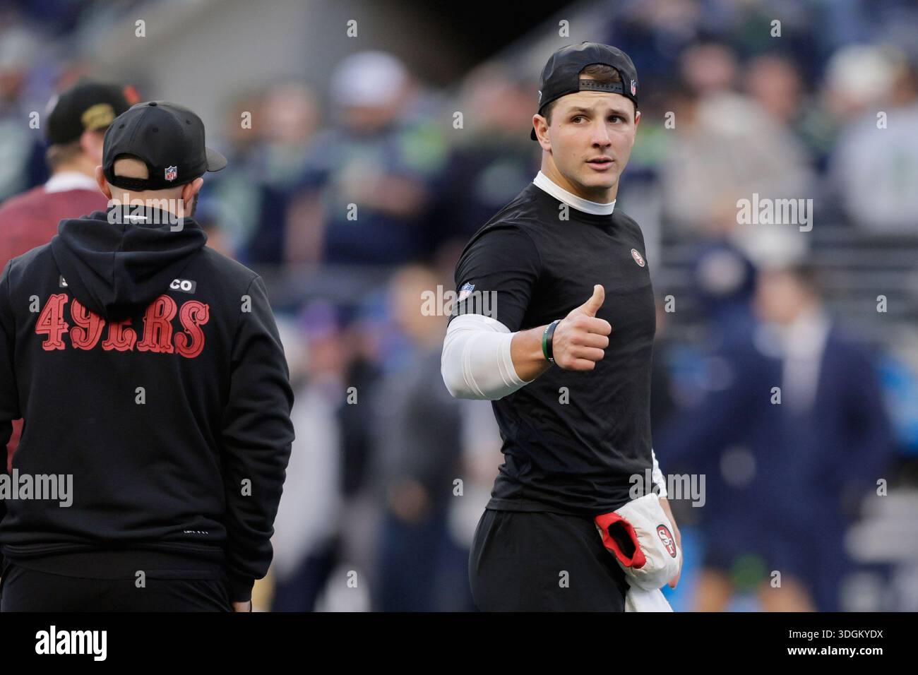 San Francisco 49ers quarterback Brock Purdy gestures as he warms up ...