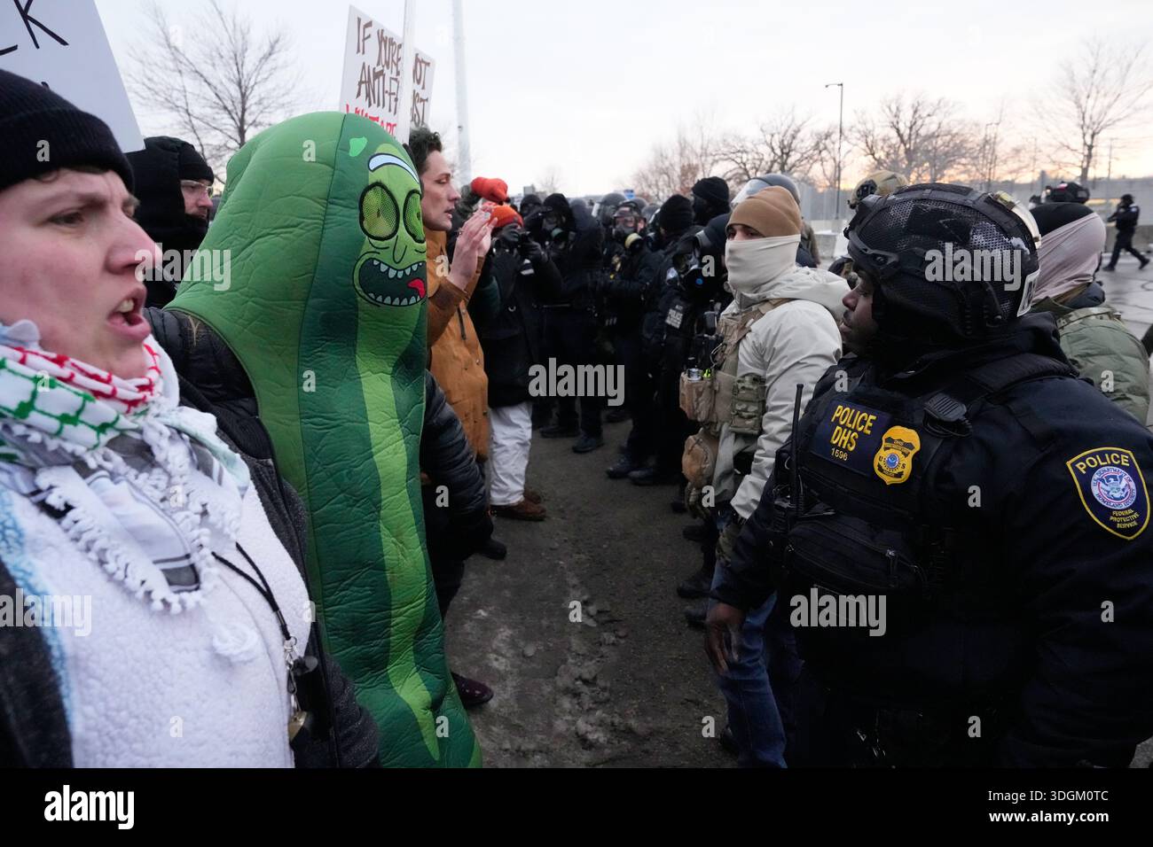 A person wearing a Pickle Rick costume stands against federal law ...