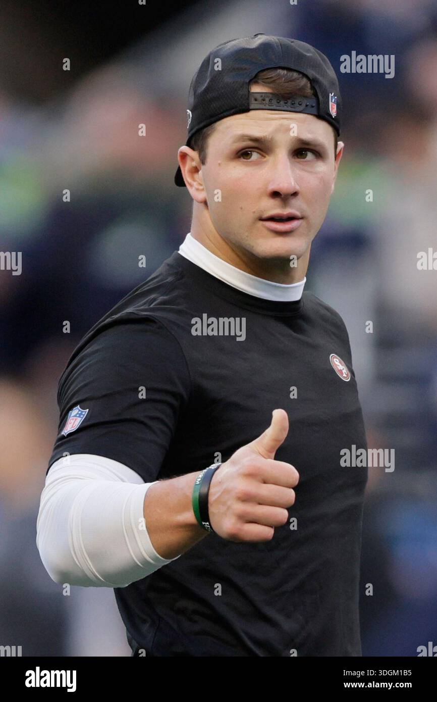 San Francisco 49ers quarterback Brock Purdy gestures as he warms up ...