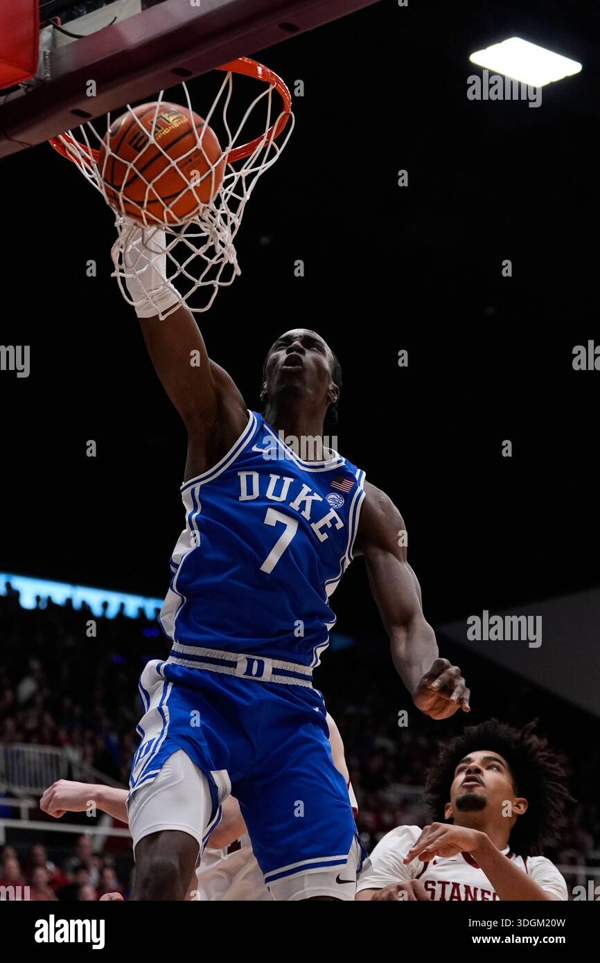 Duke guard Dame Sarr (7) dunks during the first half of an NCAA college ...
