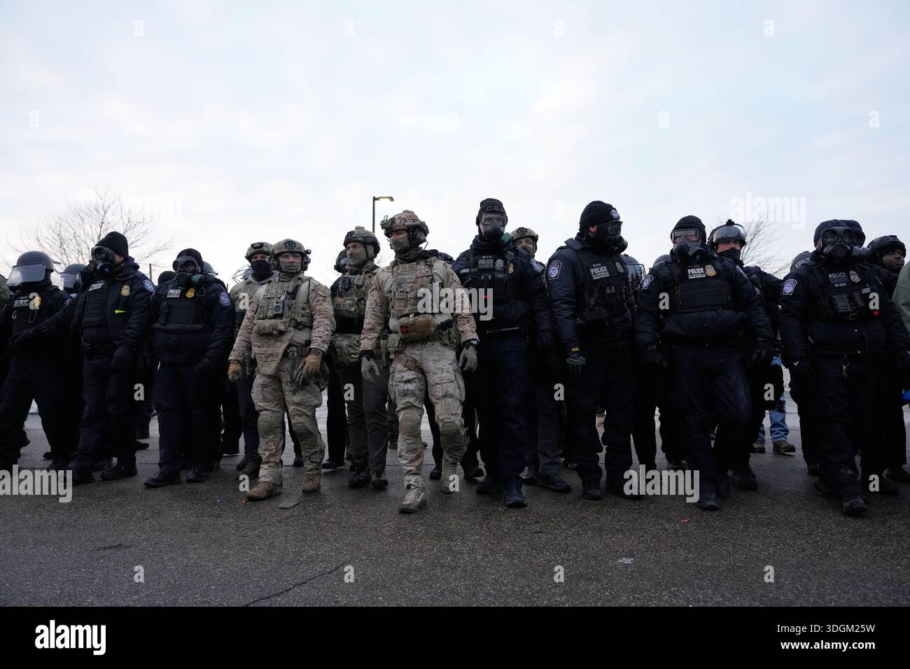 Federal law enforcement stand during a protest outside the Bishop Henry ...