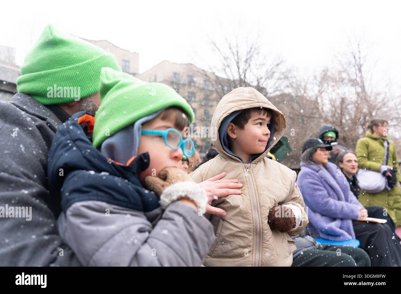 A boy smiles during a press conference to announce Tricia Shimamura as ...