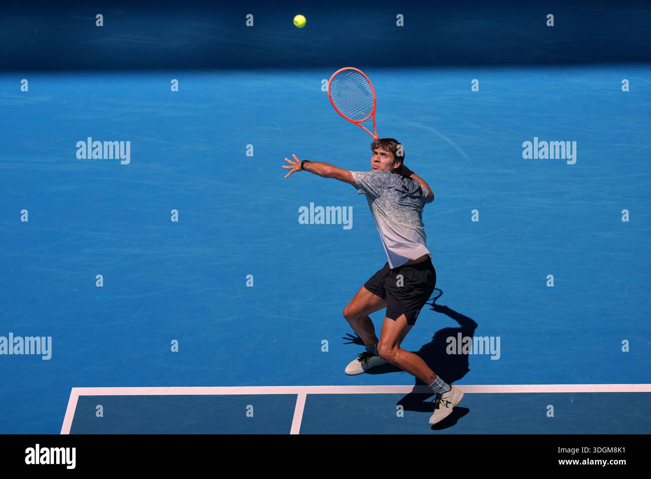 Flavio Cobolli of Italy plays a forehand return to Arthur Fery of ...