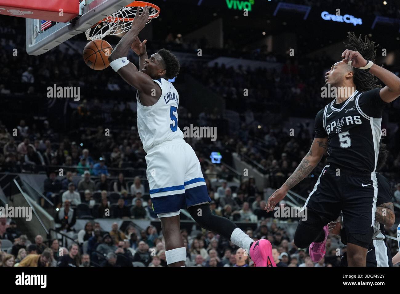Minnesota Timberwolves guard Anthony Edwards, left, scores past San ...