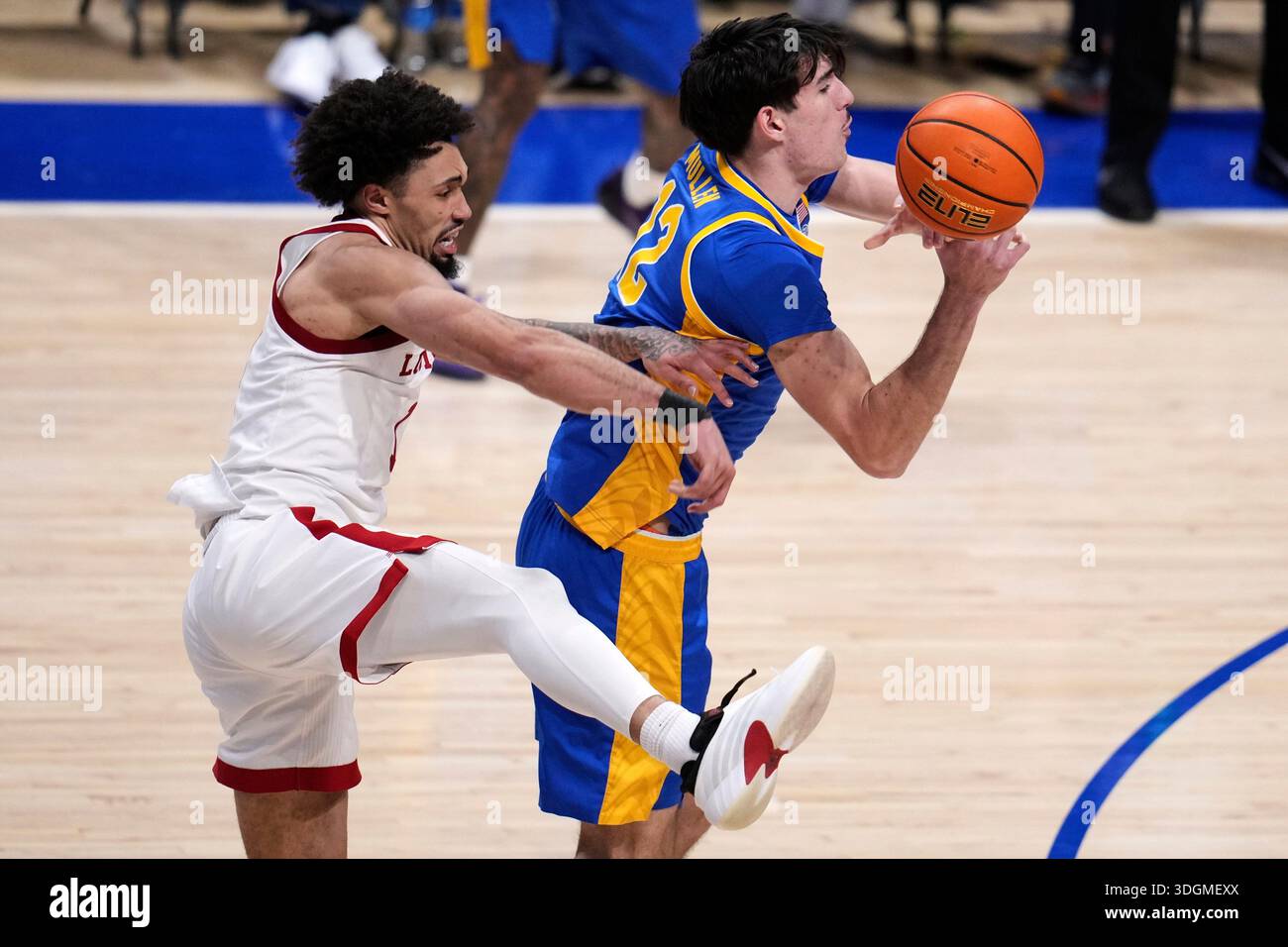 Louisville guard J'vonne Hadley, left, knocks the ball out of the hands ...