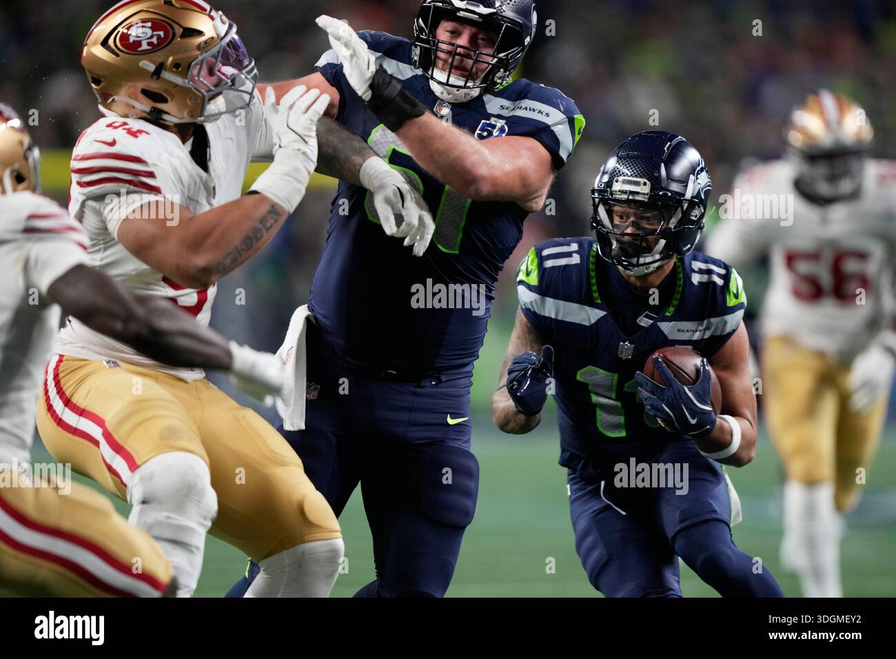 Seattle Seahawks wide receiver Jaxon Smith-Njigba (11) looks to get ...