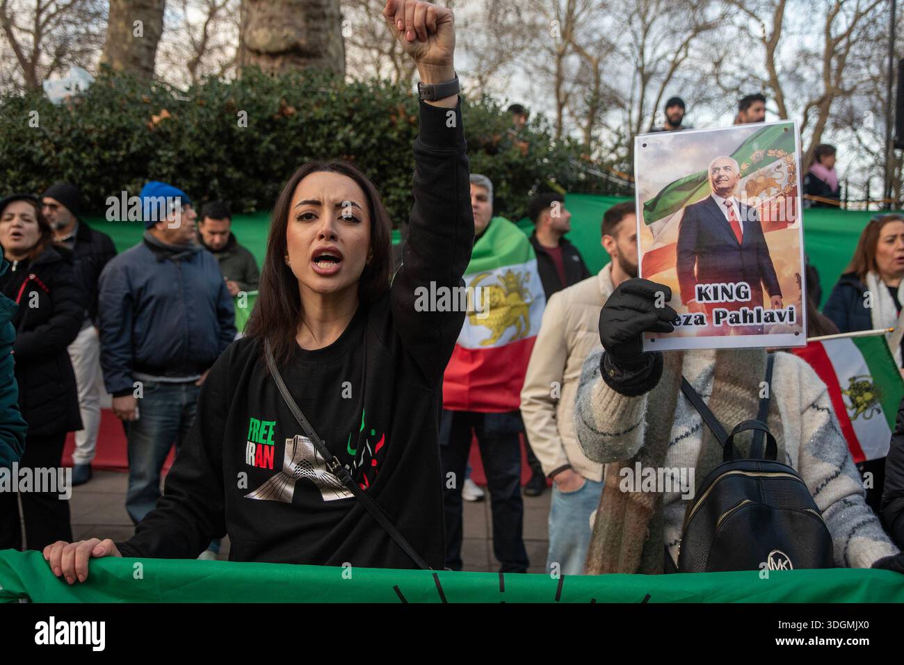 London, UK. 17th Jan, 2026. Protesters chant slogans and hold signs ...