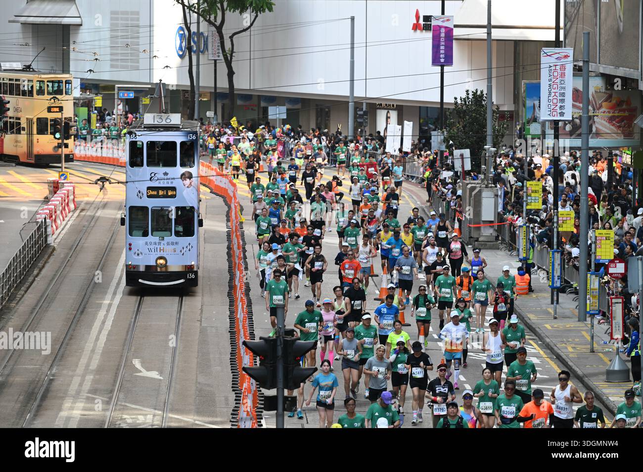 People running in the Hong Kong Marathon at Causeway Bay on January 18 ...
