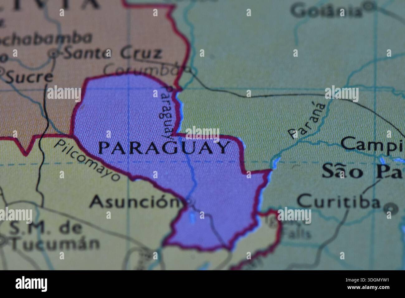 Macro view of a printed atlas map showing Paraguay, its capital ...