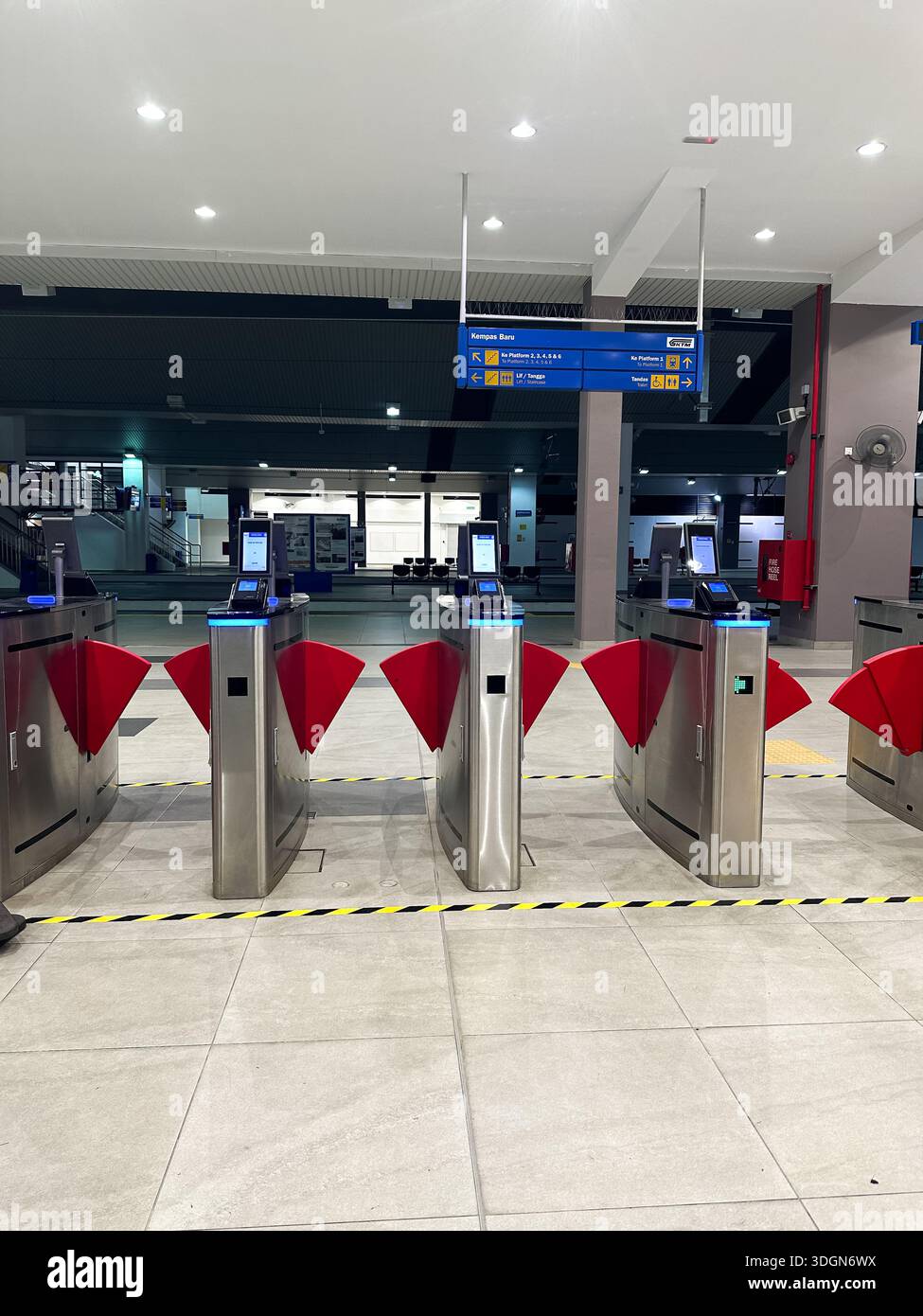 Johor, Malaysia, January 14, 2026: Modern fare gate with digital screen ...