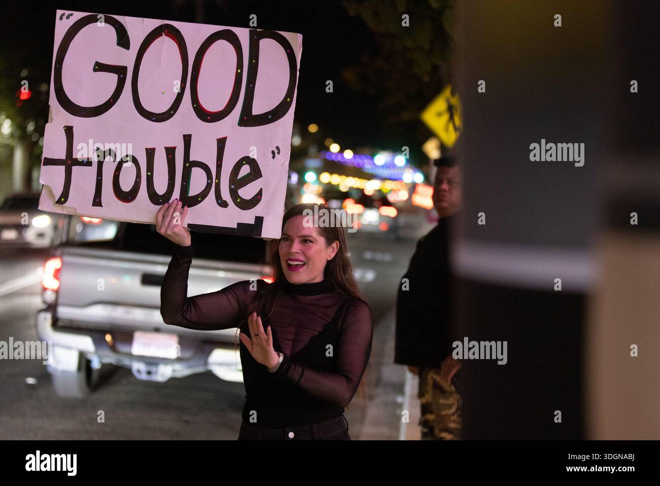 Los Angeles, United States. 17th Jan, 2026. Protester holds a placard ...