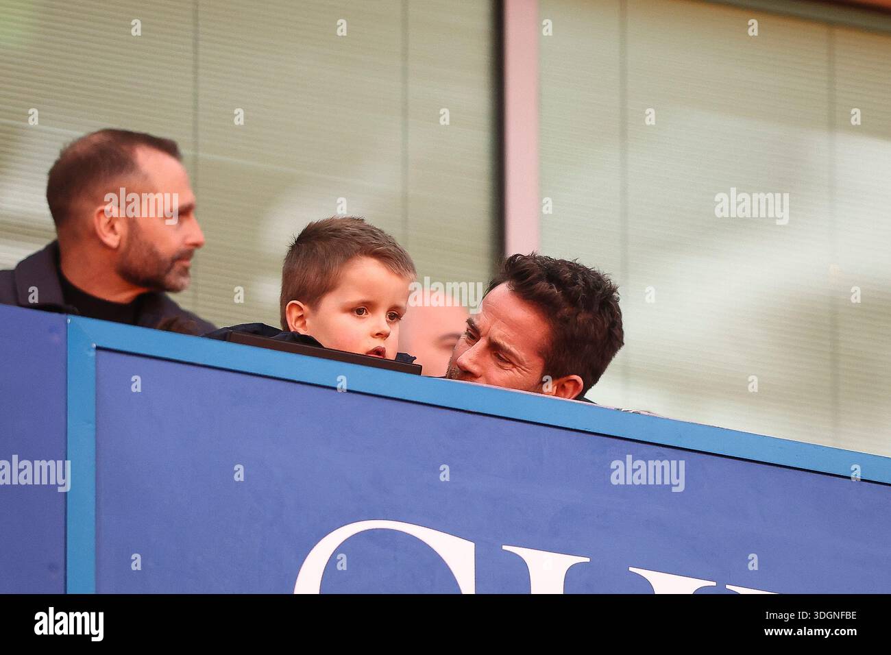 Jamie Redknapp and son sit in front of Chelsea Sporting Director Paul ...