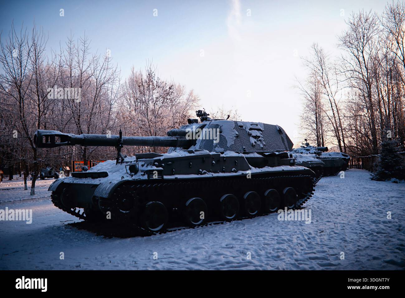 Military tank in a row. Battle tank in the snow on the roadside of ...