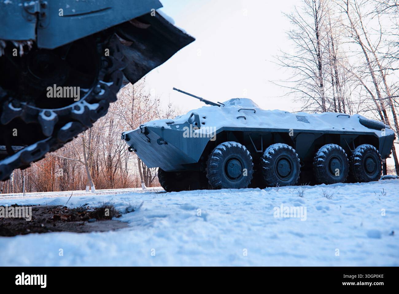 Military tank in a row. Battle tank in the snow on the roadside of ...