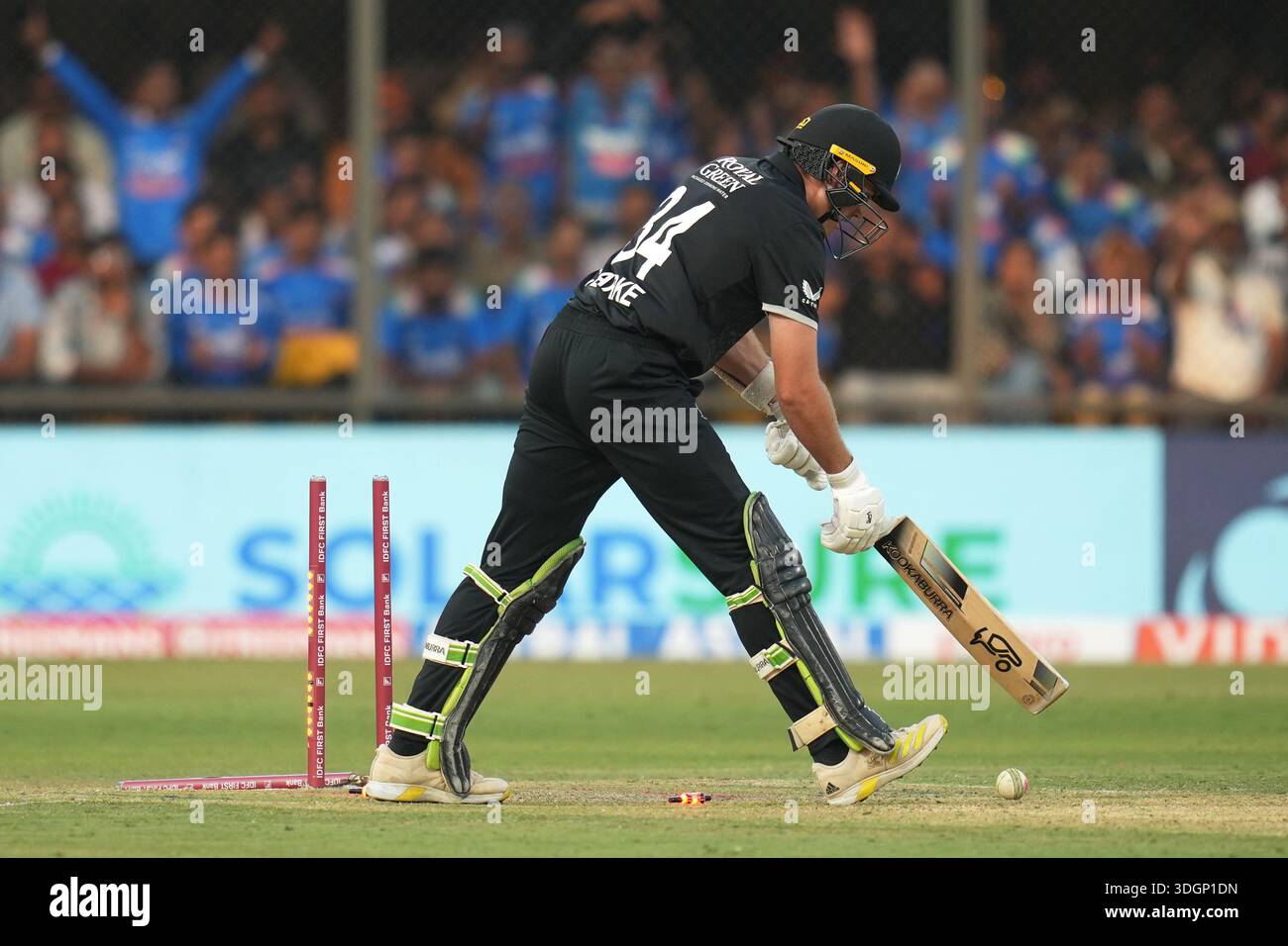 New Zealand's Kristian Clarke is bowled out by India's Harshit Rana ...