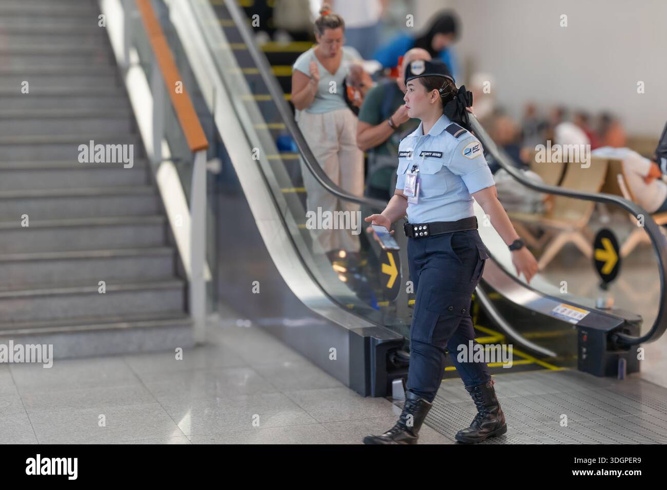 Phuket, Thailand, January 6, 2026: A police officer in Phuket airport ...