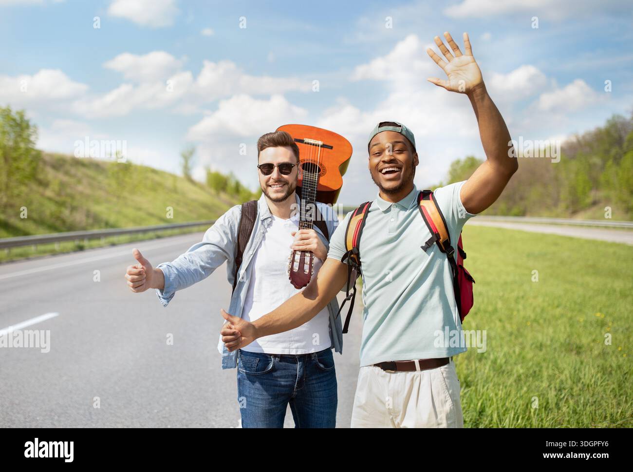 Two diverse male friends catching hi-res stock photography and images ...