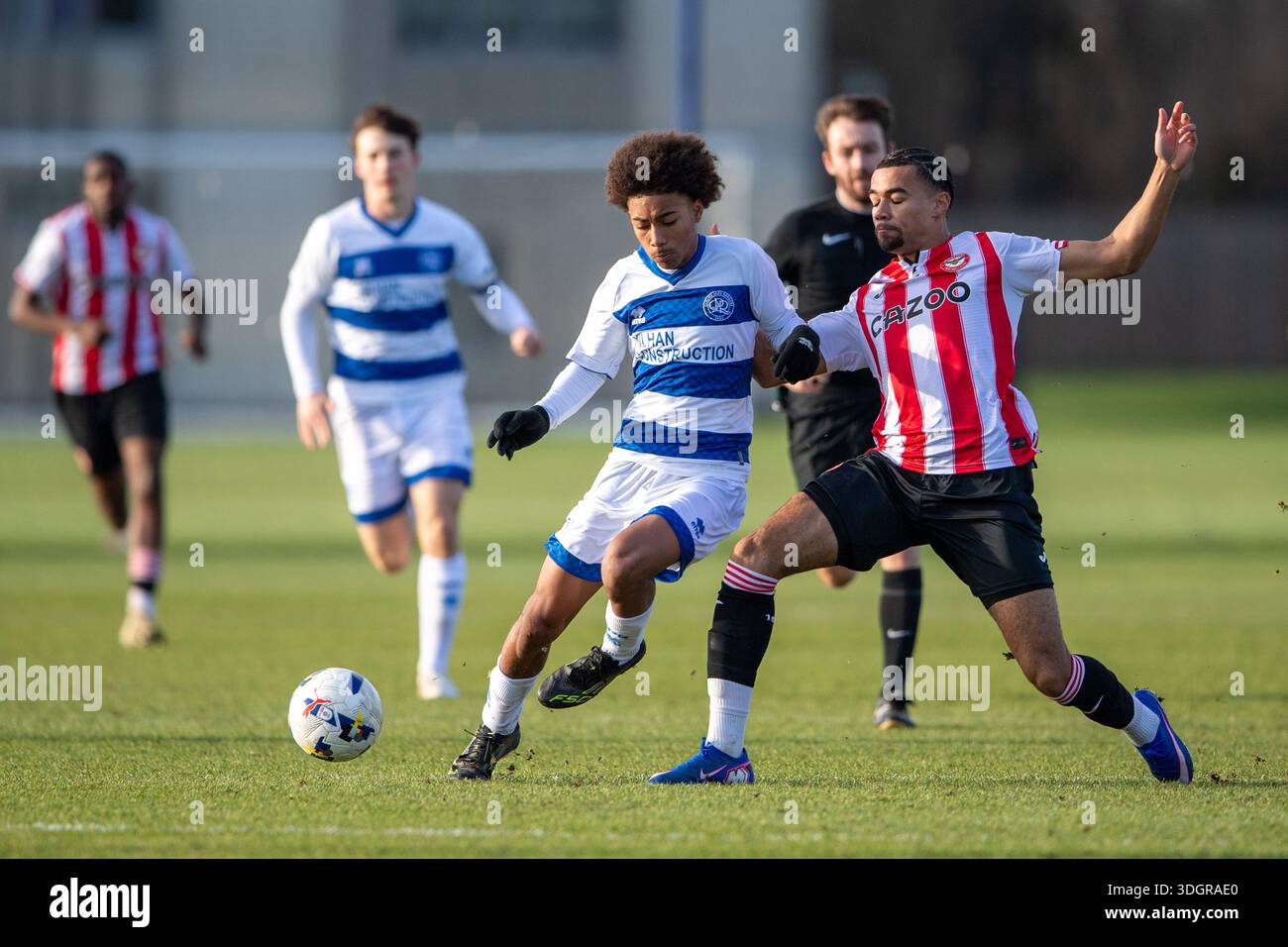 Leon Scarlett (QPR Dev) comes under pressure from Maxwell McKnight (#2 ...