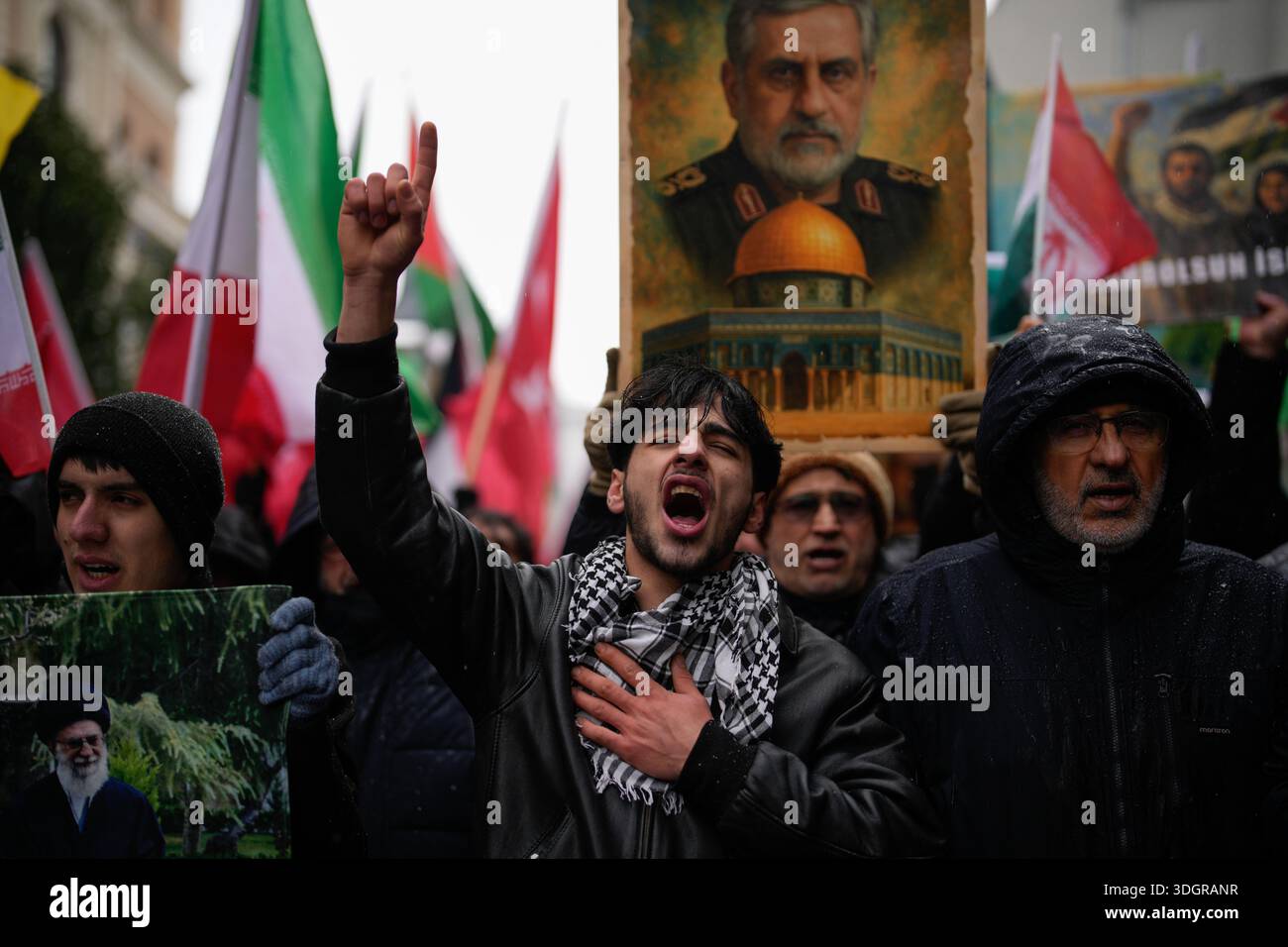 People shout slogans during an anti-U.S. and anti-Israeli rally in ...