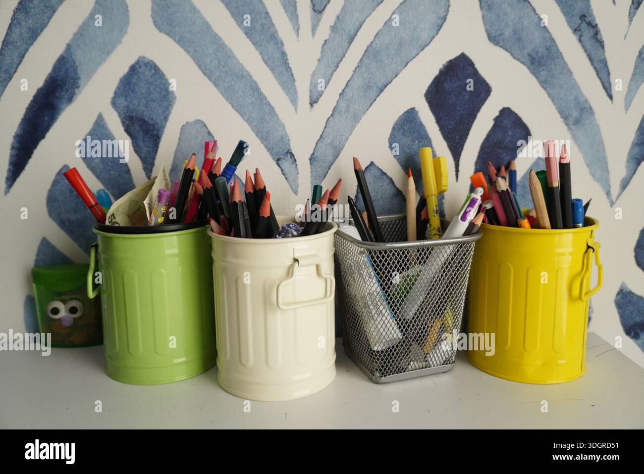 Collection of colored pencils in various containers hi-res stock ...