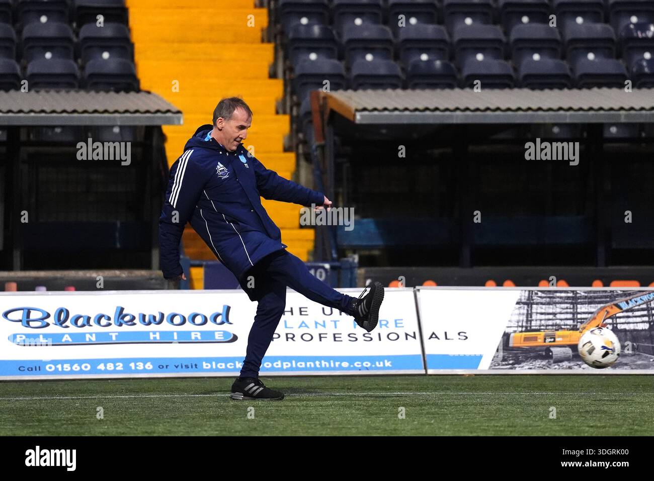 Auchinleck Talbot manager Tommy Sloan inspects the pitch ahead of the ...