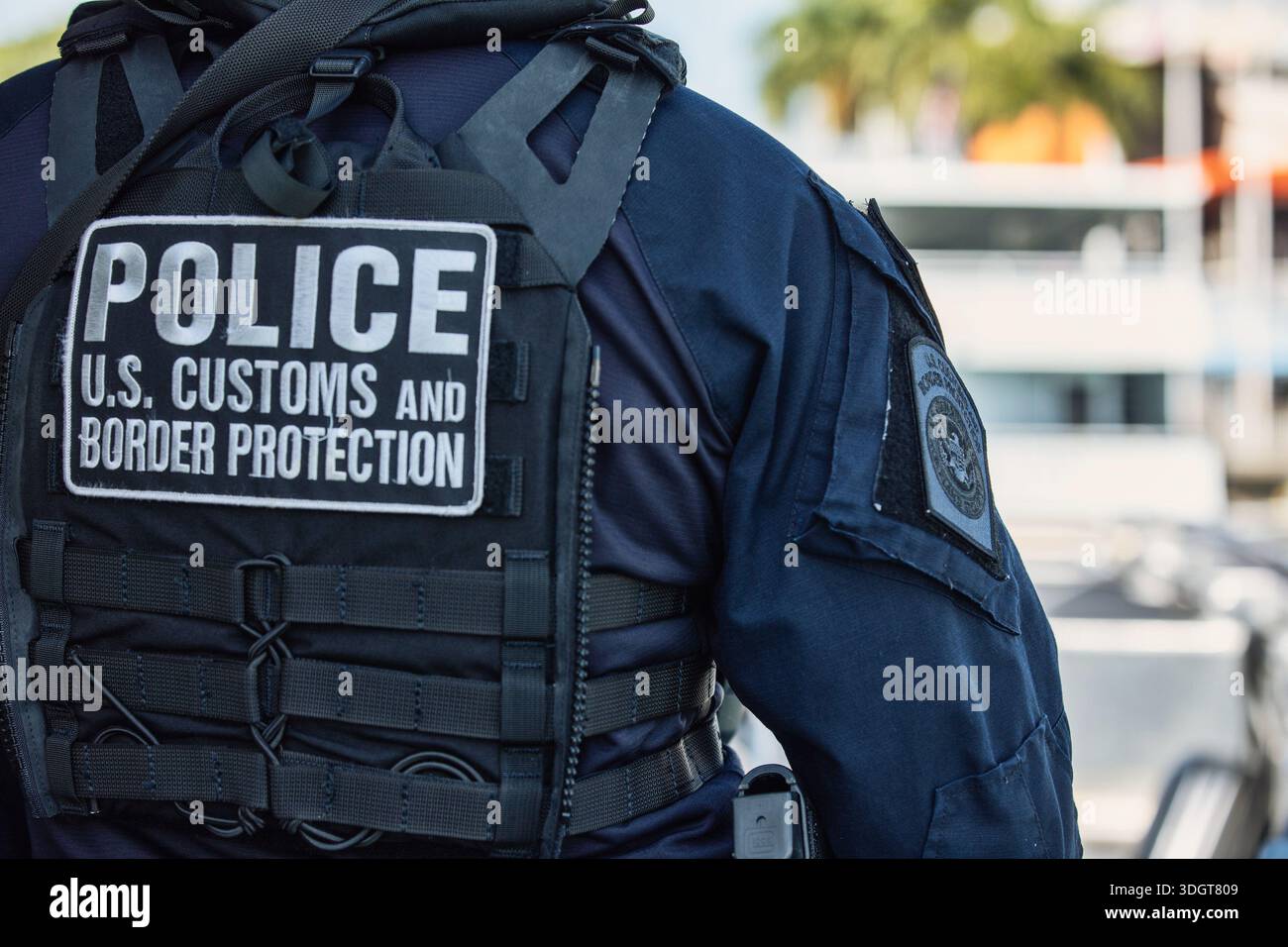 A close-up shot of a US Customs and Border Protection officer wearing a ...