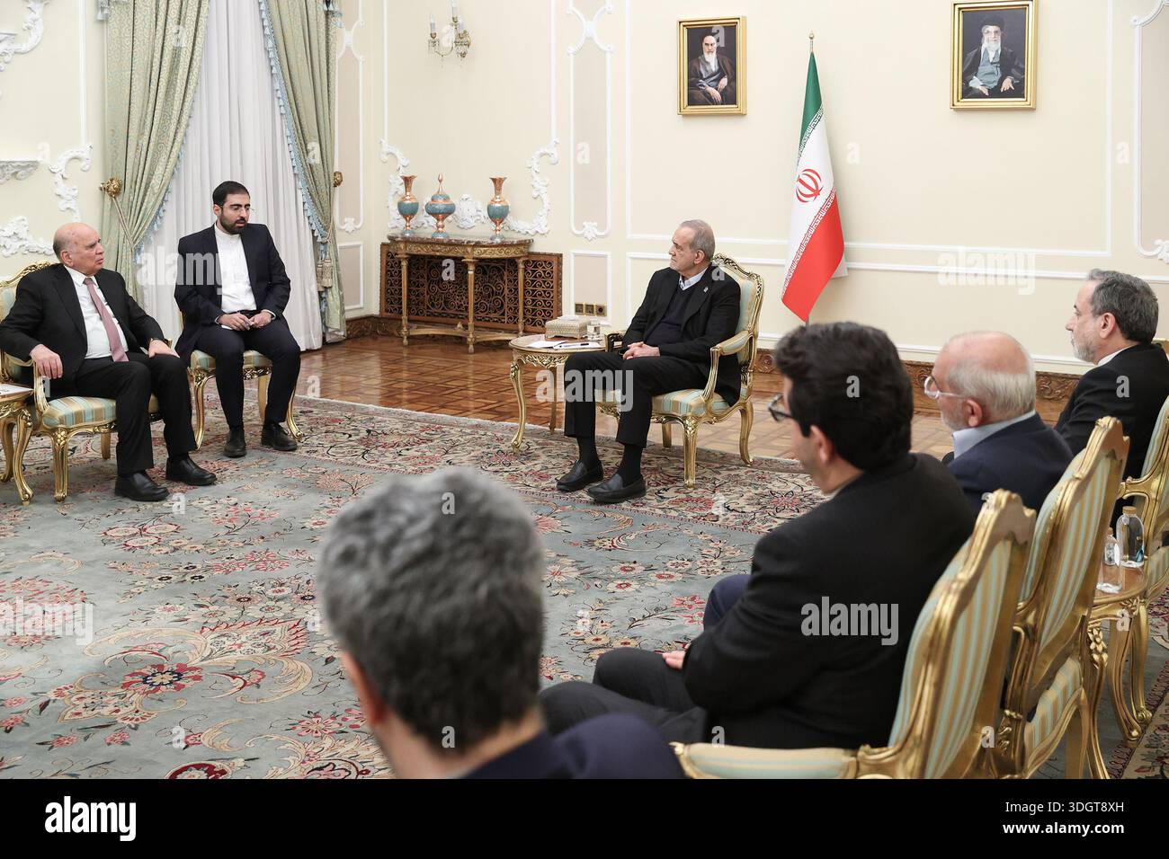Tehran, Iran. 18th Jan, 2026. Iranian President MASOUD PEZESHKIAN (C ...