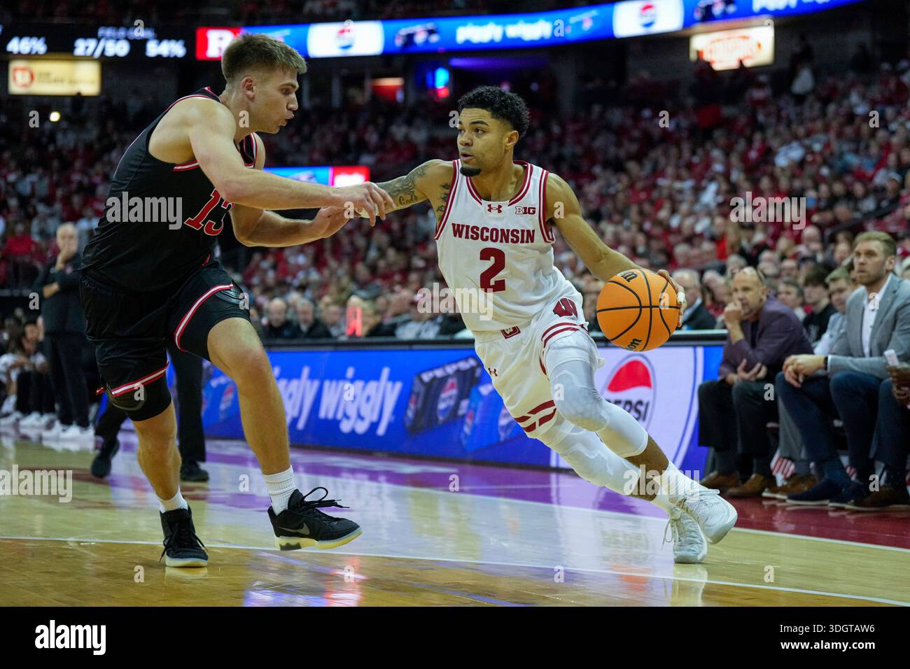 Wisconsin's Nick Boyd (2) against Rutgers' Harun Zrno (13) during the ...