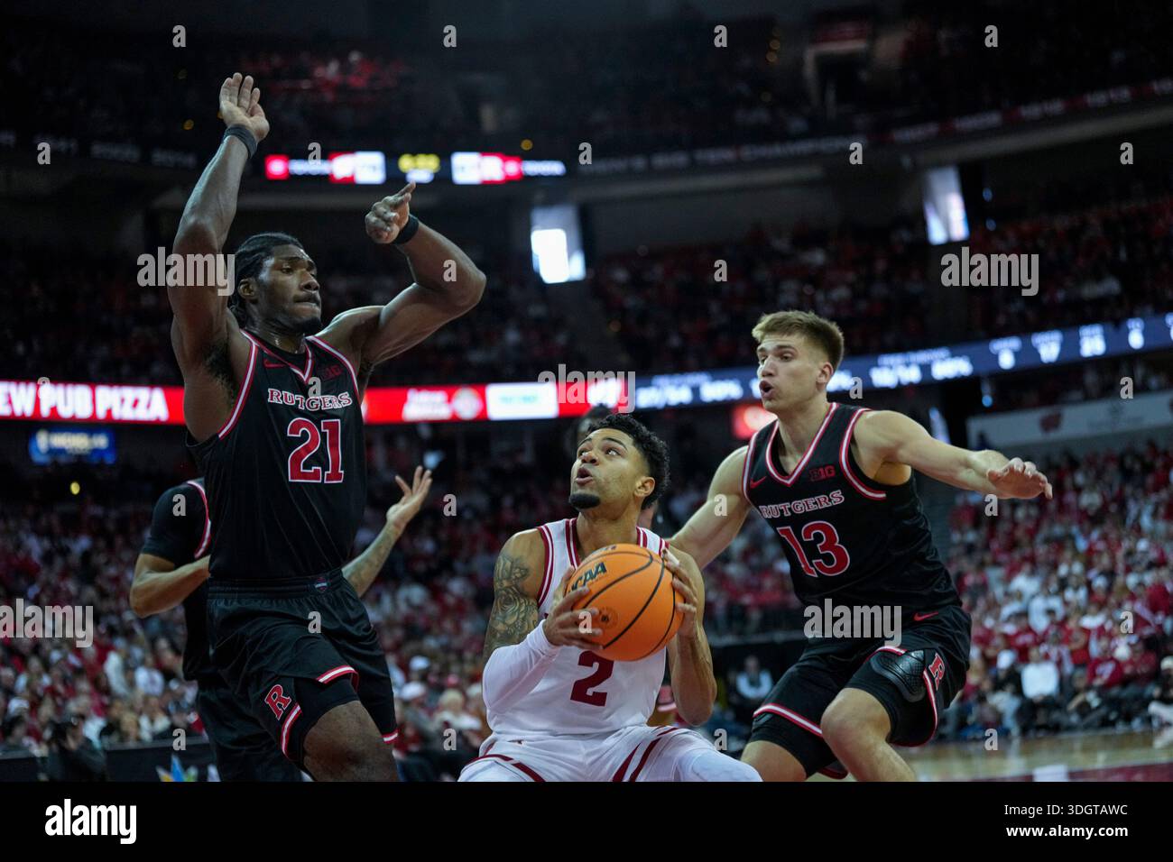 Wisconsin's Nick Boyd (2) against Rutgers' Emmanuel Ogbole (21) and ...