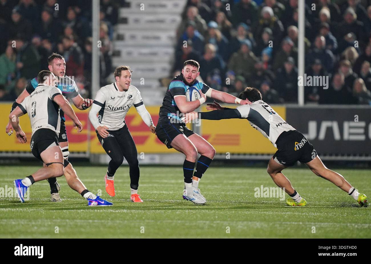 Glasgow Warriors' Ollie Smith holds off Saracens' Lucio Cinti during ...
