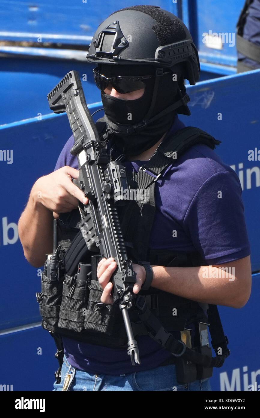 A police officer guards the scene where a fellow officer was killed in ...