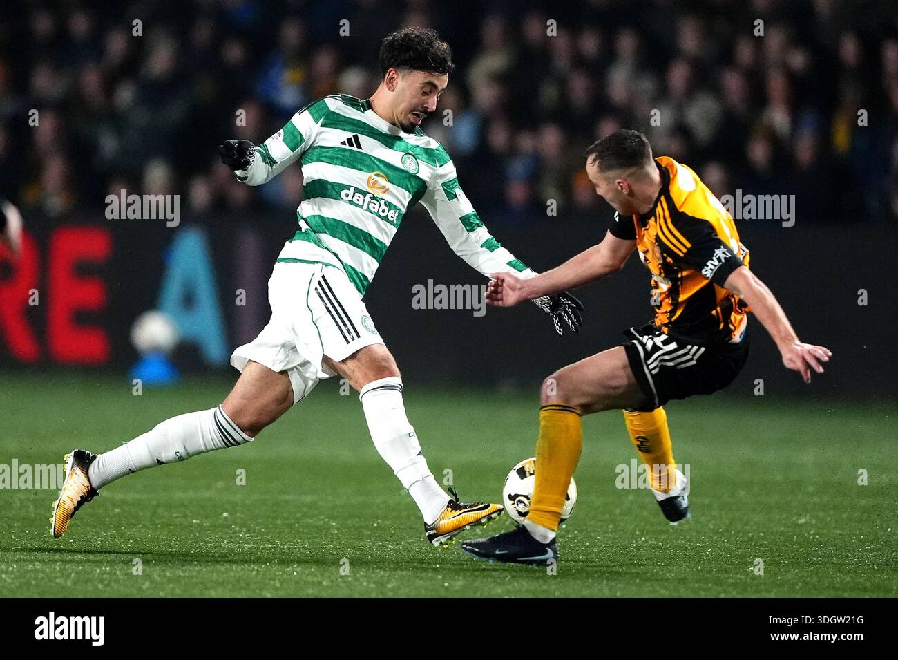 Celtic's Sebastian Tounekti (left) and Auchinleck Talbot's Ross Clark ...