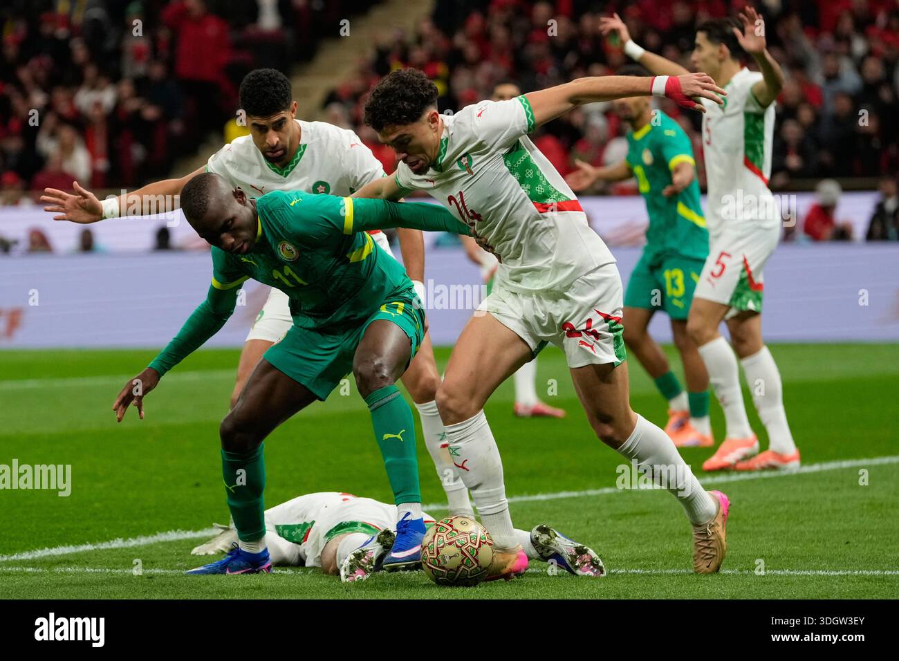 Senegal's Nicolas Jackson, left, and Morocco's Neil Yoni El Aynaoui ...