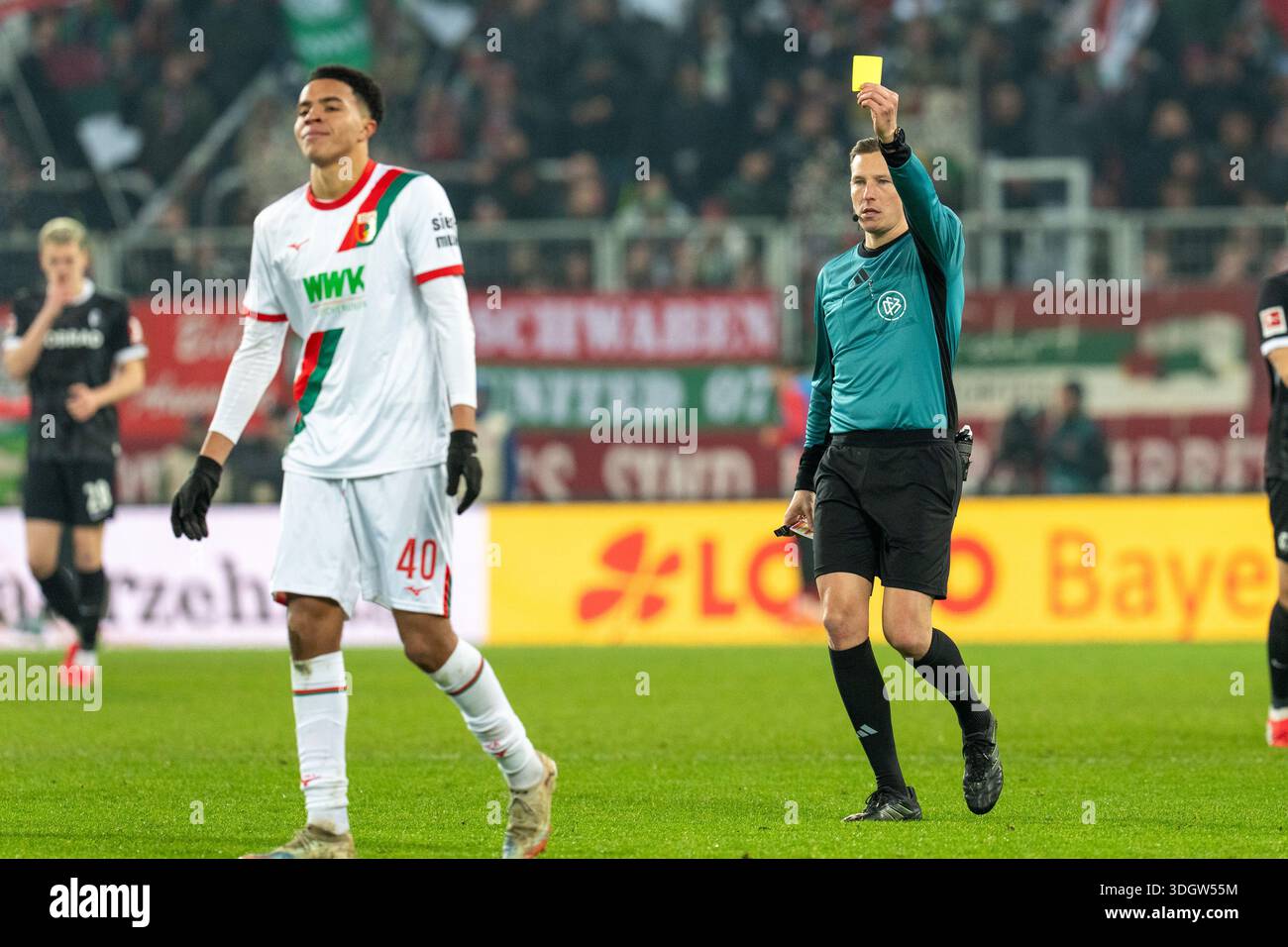AUGSBURG, GERMANY - JANUARY 18, 2026: referee Martin Petersen shows a ...