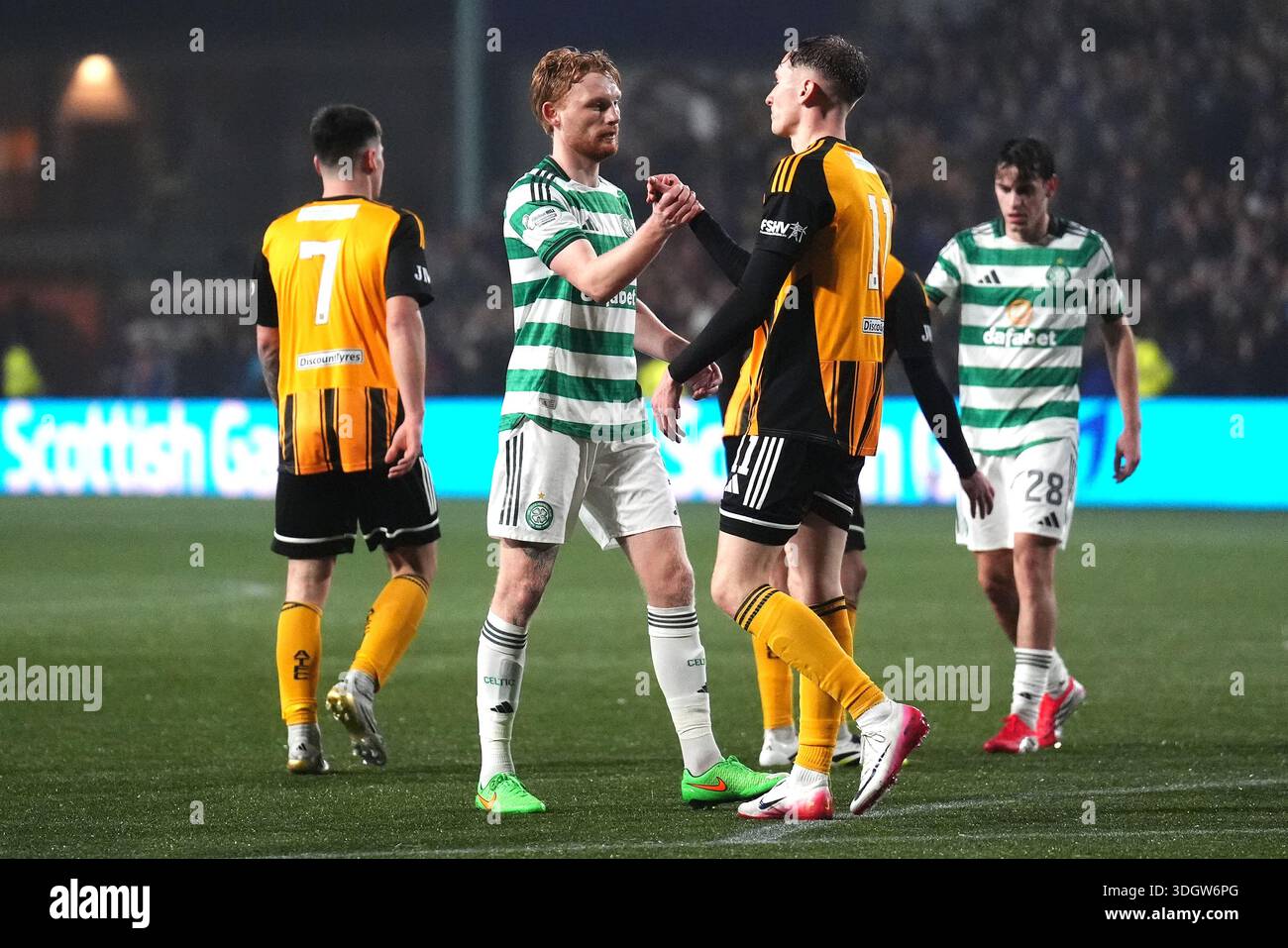 Celtic's Liam Scales and Auchinleck Talbot's Luke Gillies (right) shake ...